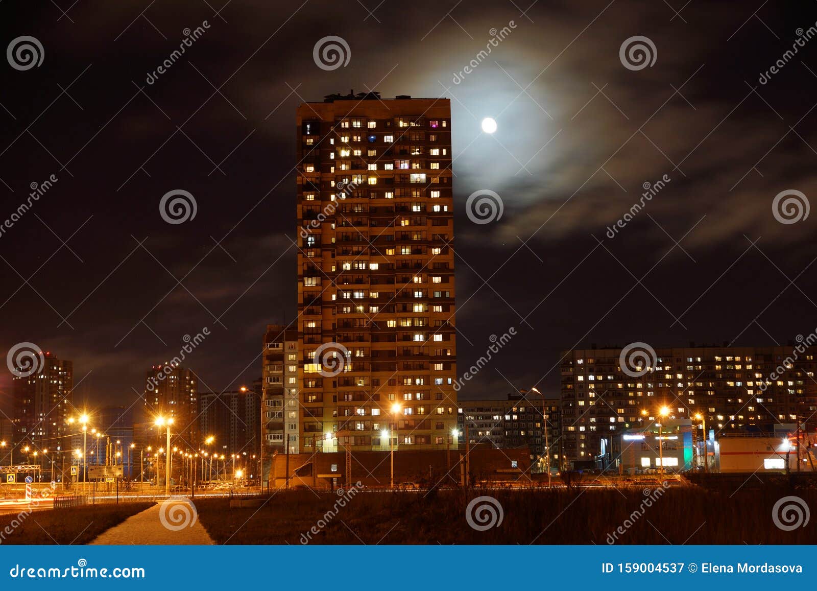 High Multi-storey Residential Building Illuminated on a Moonlit Night ...