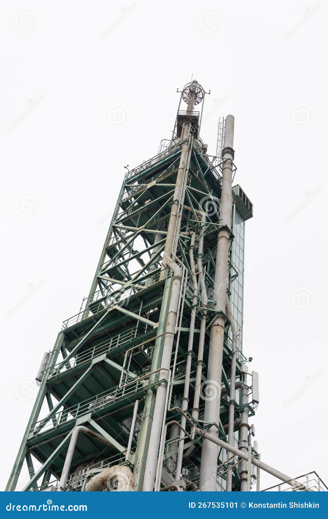 High Oil and Gas Processing Tower on a Background of Grey Sky Stock ...