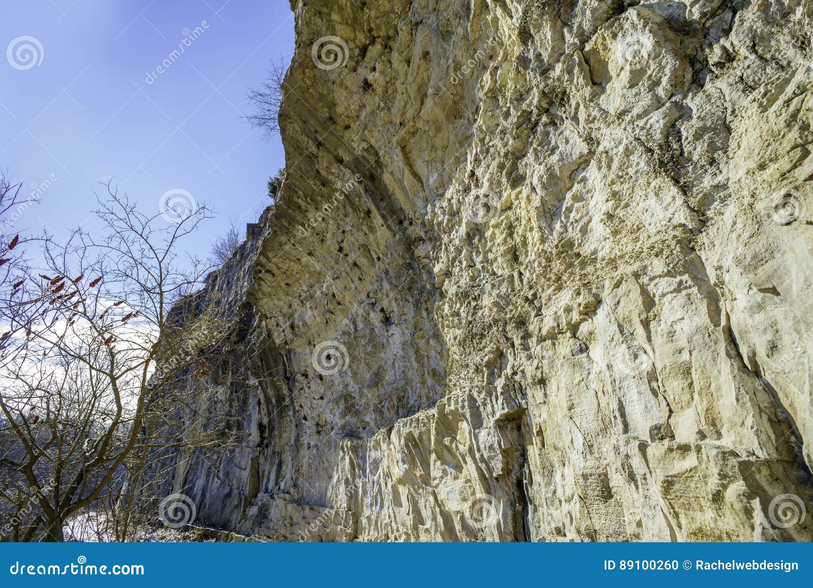High Overhanging Cliff Wall Framing a Narrow Hikiing Path in Win Stock ...