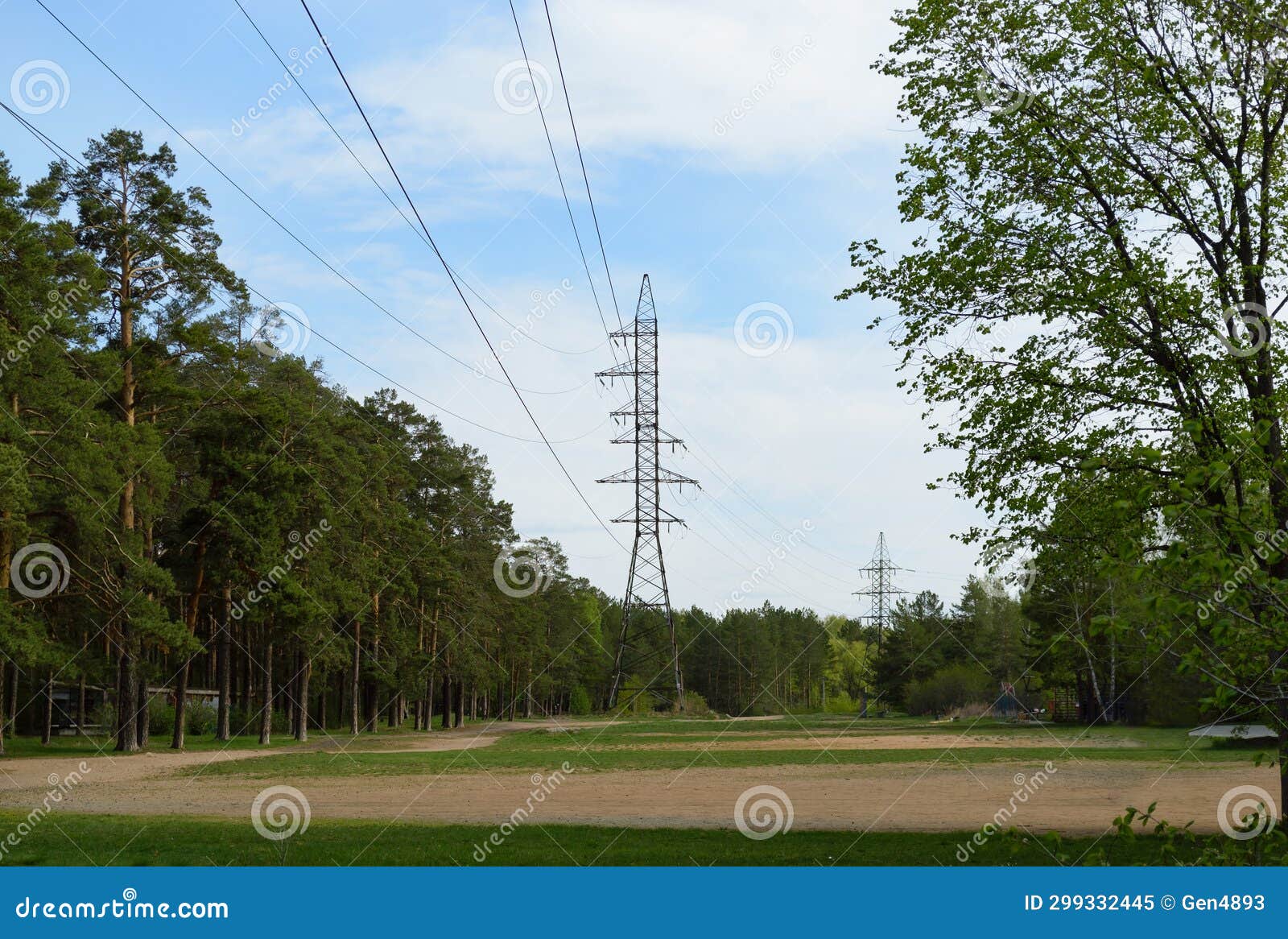High Power Lines Stand in the Clearing of the Green Forest Stock Image ...