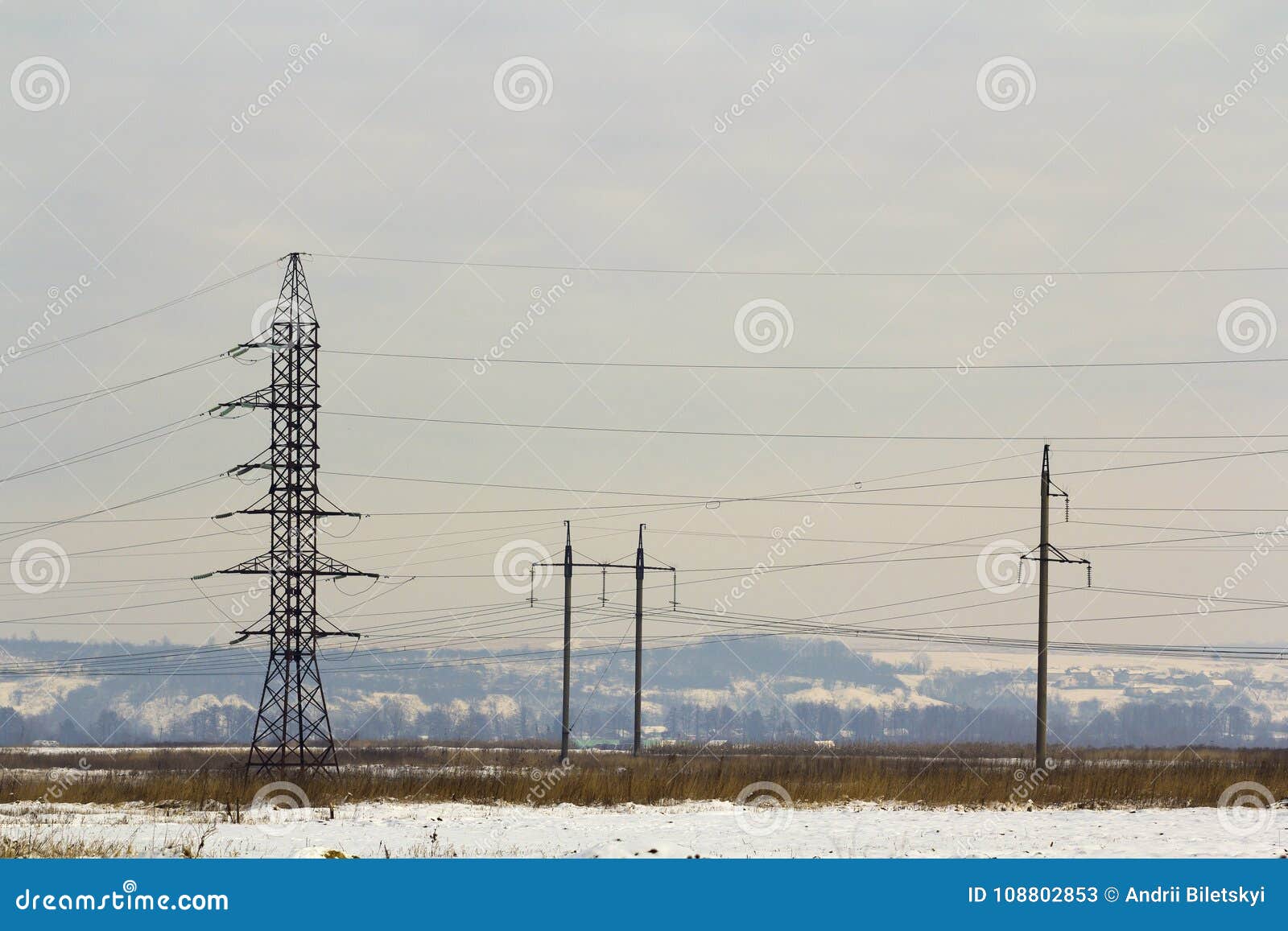 High Power Powerline Poles with High Voltage Cables through the Field ...