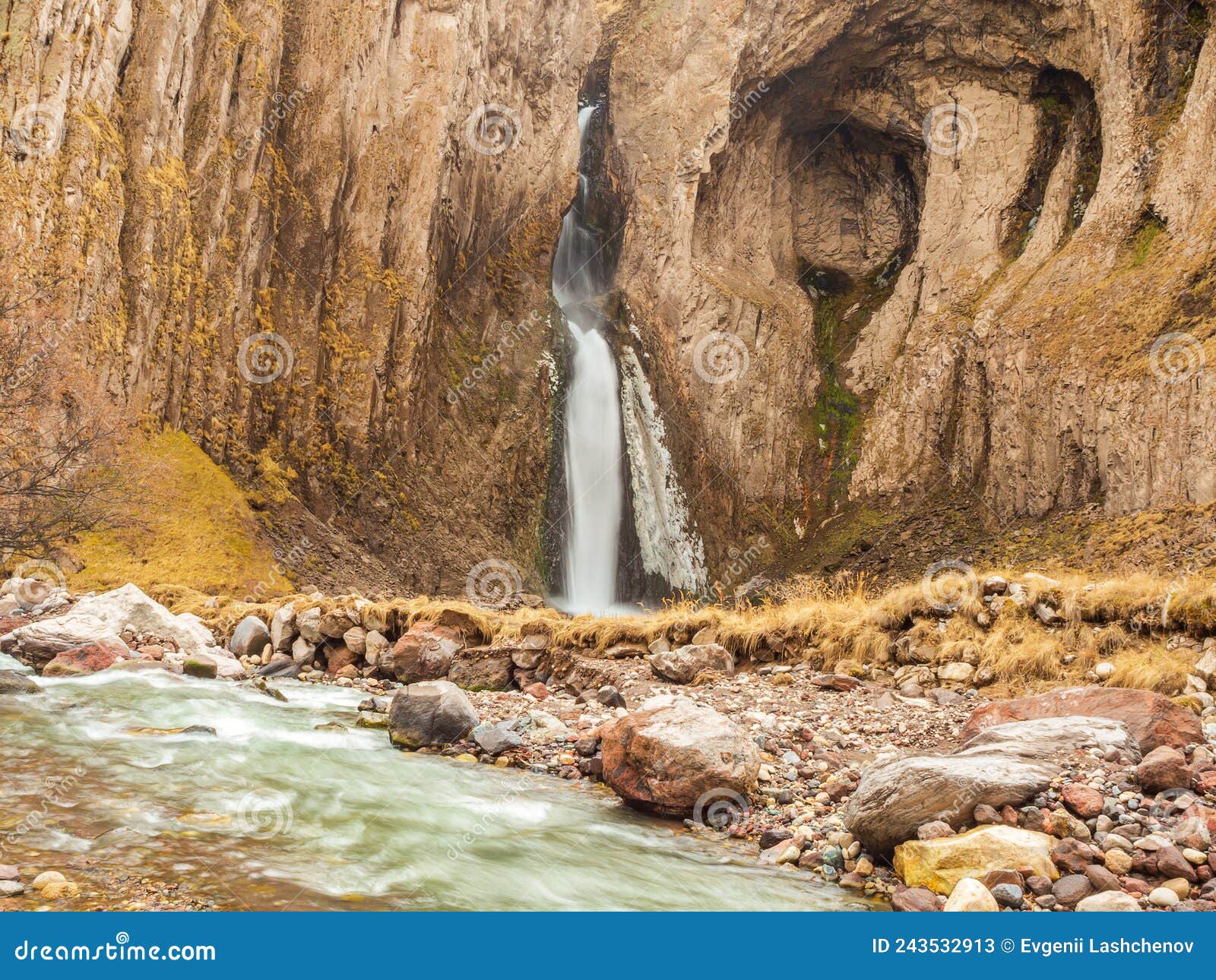 A High Powerful and Smooth Stream of a Waterfall Flows in Steep Rocks ...