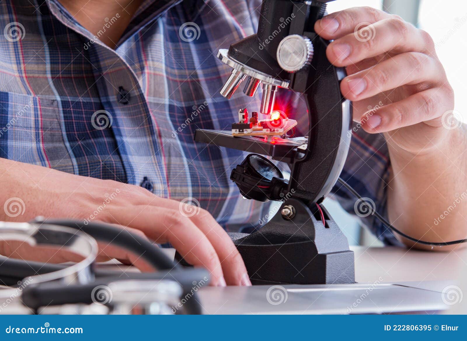 High Precision Engineering with Man Working with Microscope Stock Image ...