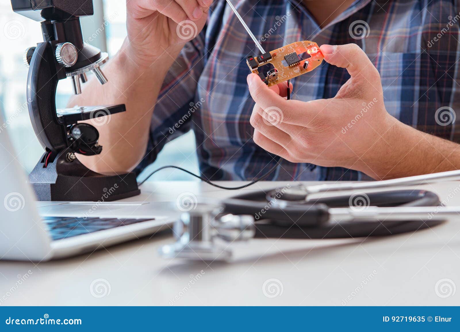 The High Precision Engineering with Man Working with Microscope Stock ...