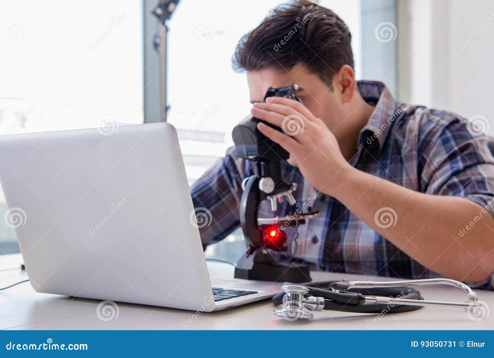 The High Precision Engineering with Man Working with Microscope Stock ...