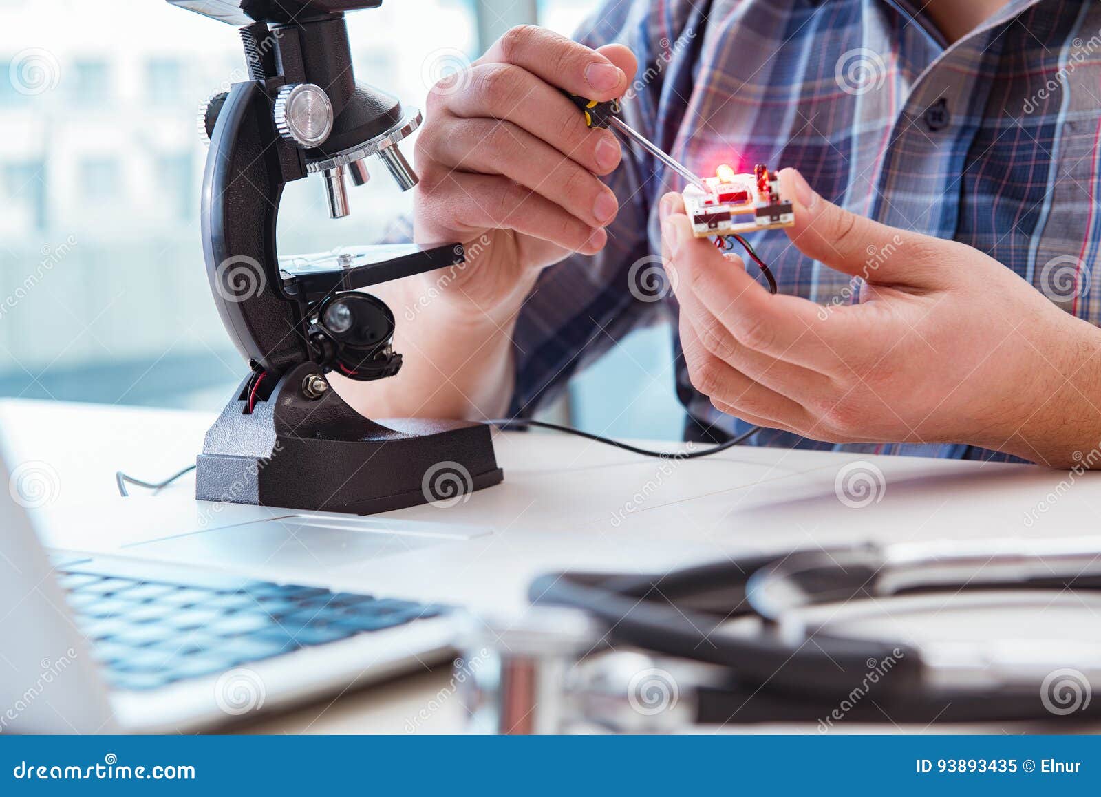 The High Precision Engineering with Man Working with Microscope Stock ...