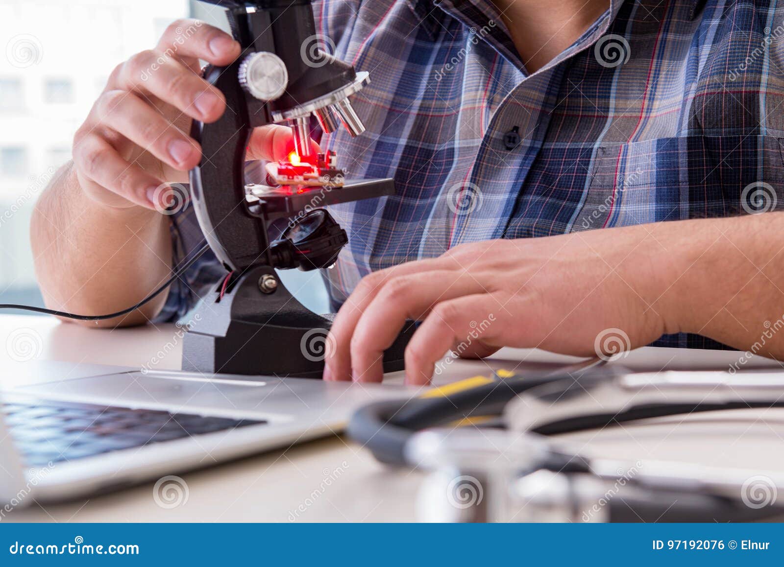 The High Precision Engineering with Man Working with Microscope Stock ...