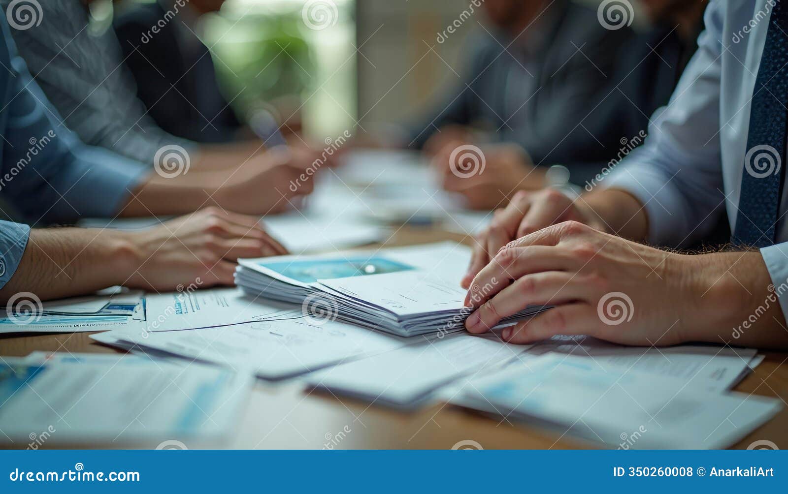 Collaborative Hands Reaching for Documents at Office Table Stock ...