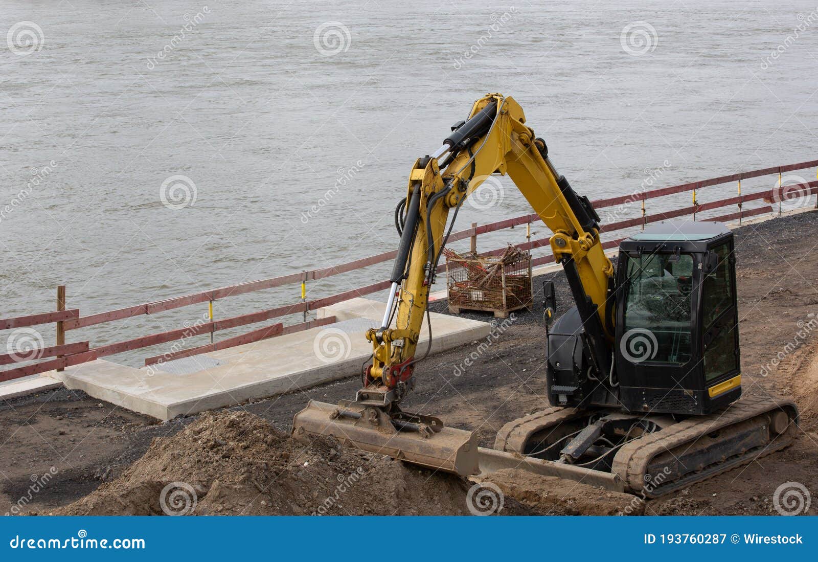 High Reach Excavator during a Construction Close To a Lake Stock Image ...