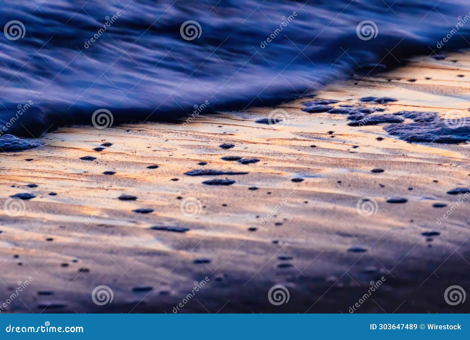 A Close Up of the Edge of a Sand Covered Beach Stock Image - Image of ...