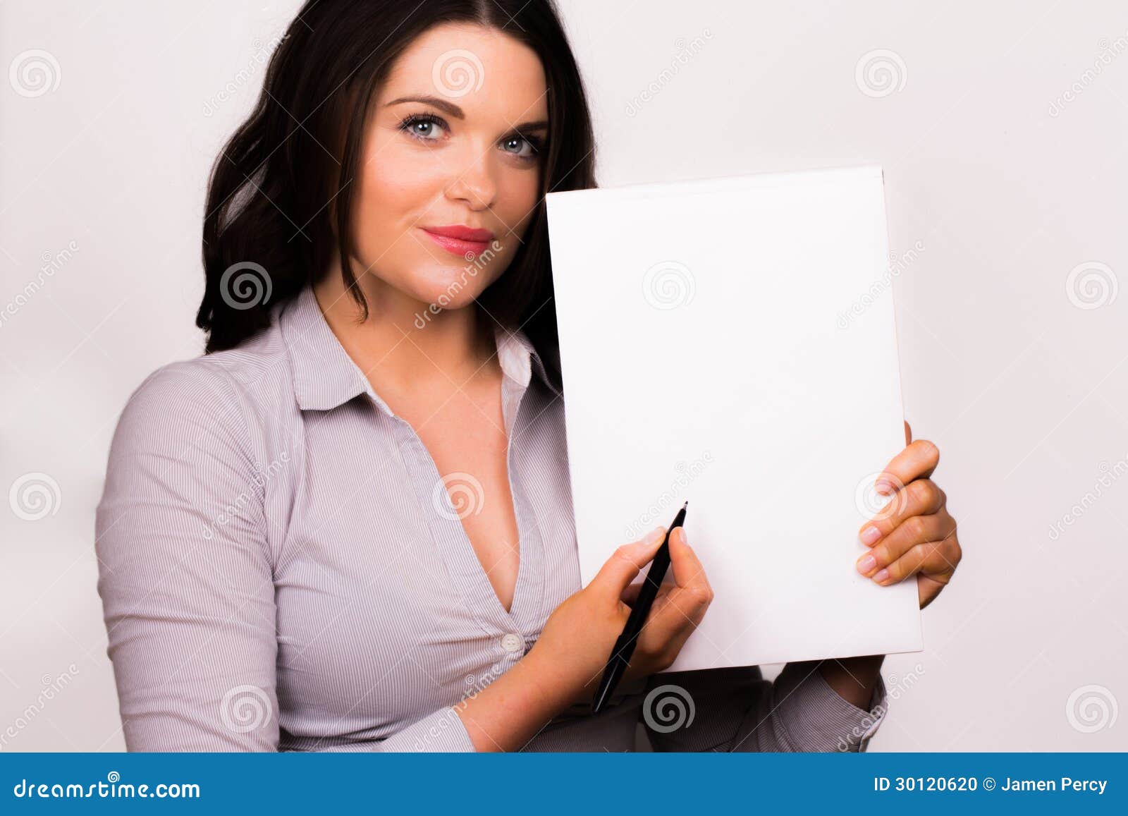 Beautiful Young Female Presenting with a Pen and Paper Stock Photo ...