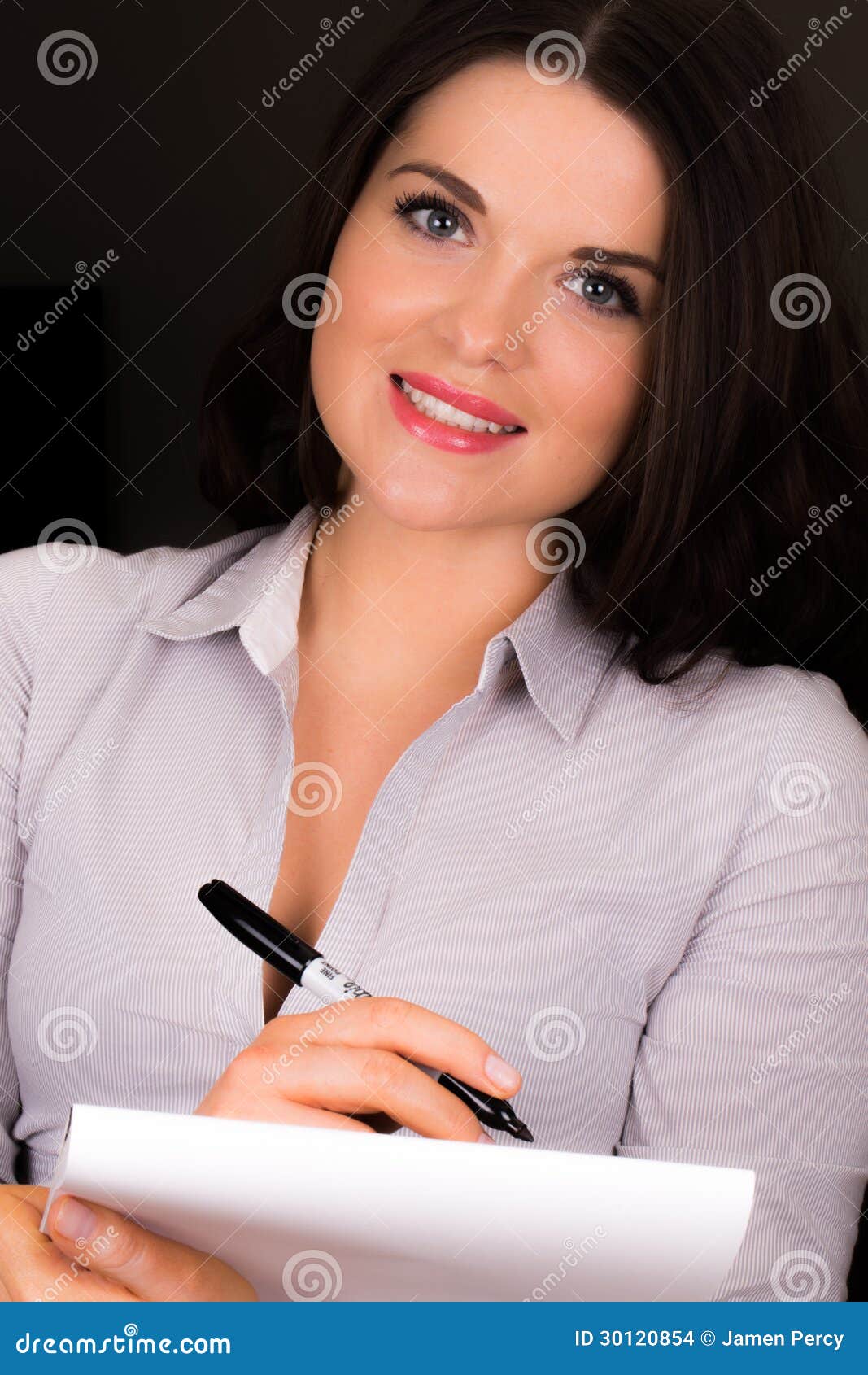 Beautiful Young Female Presenting with a Pen and Paper Stock Photo ...