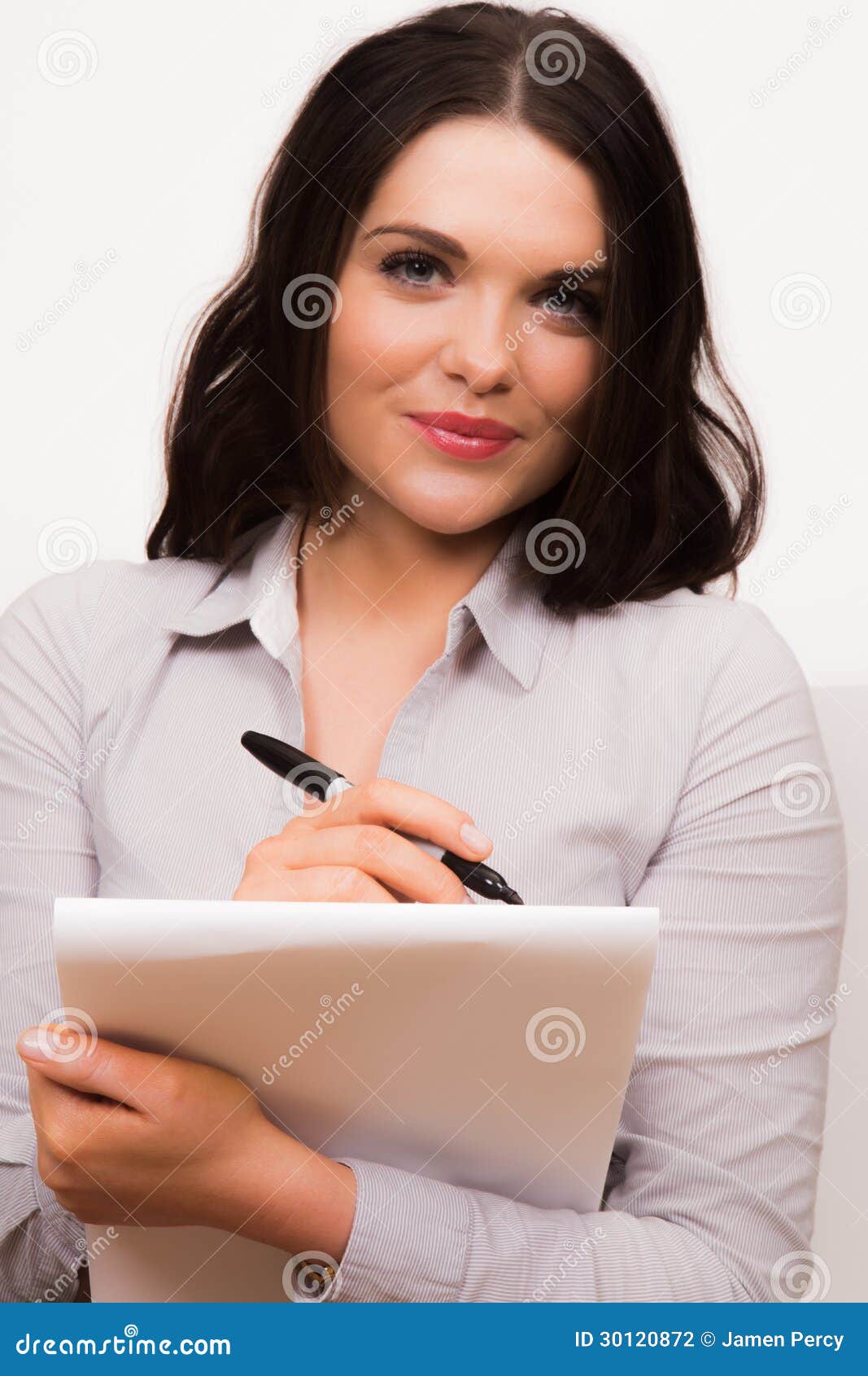 Beautiful Young Female Presenting with a Pen and Paper Stock Photo ...