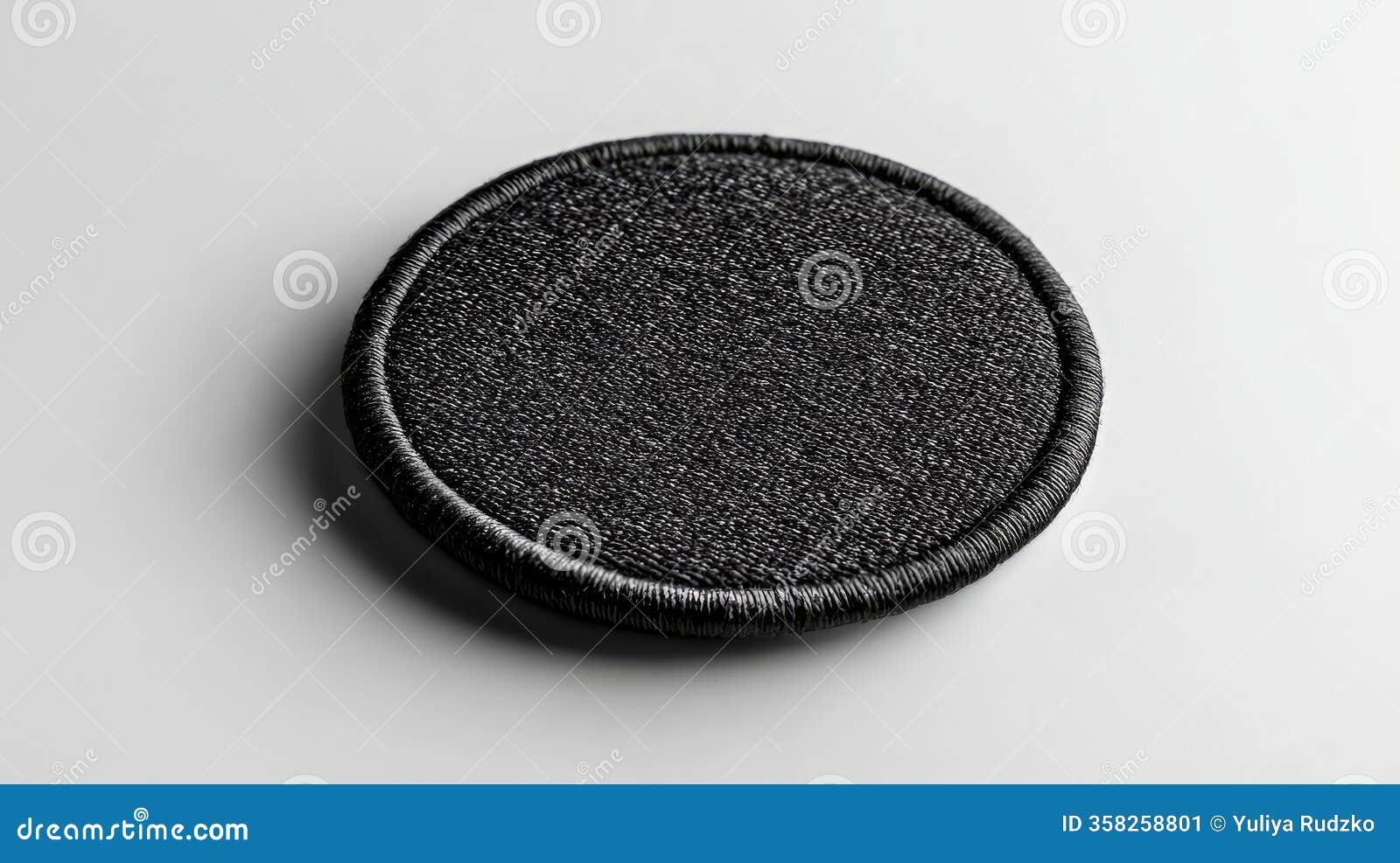 High-Resolution Mockup of a Standalone Rounded Embroidered Black Patch ...