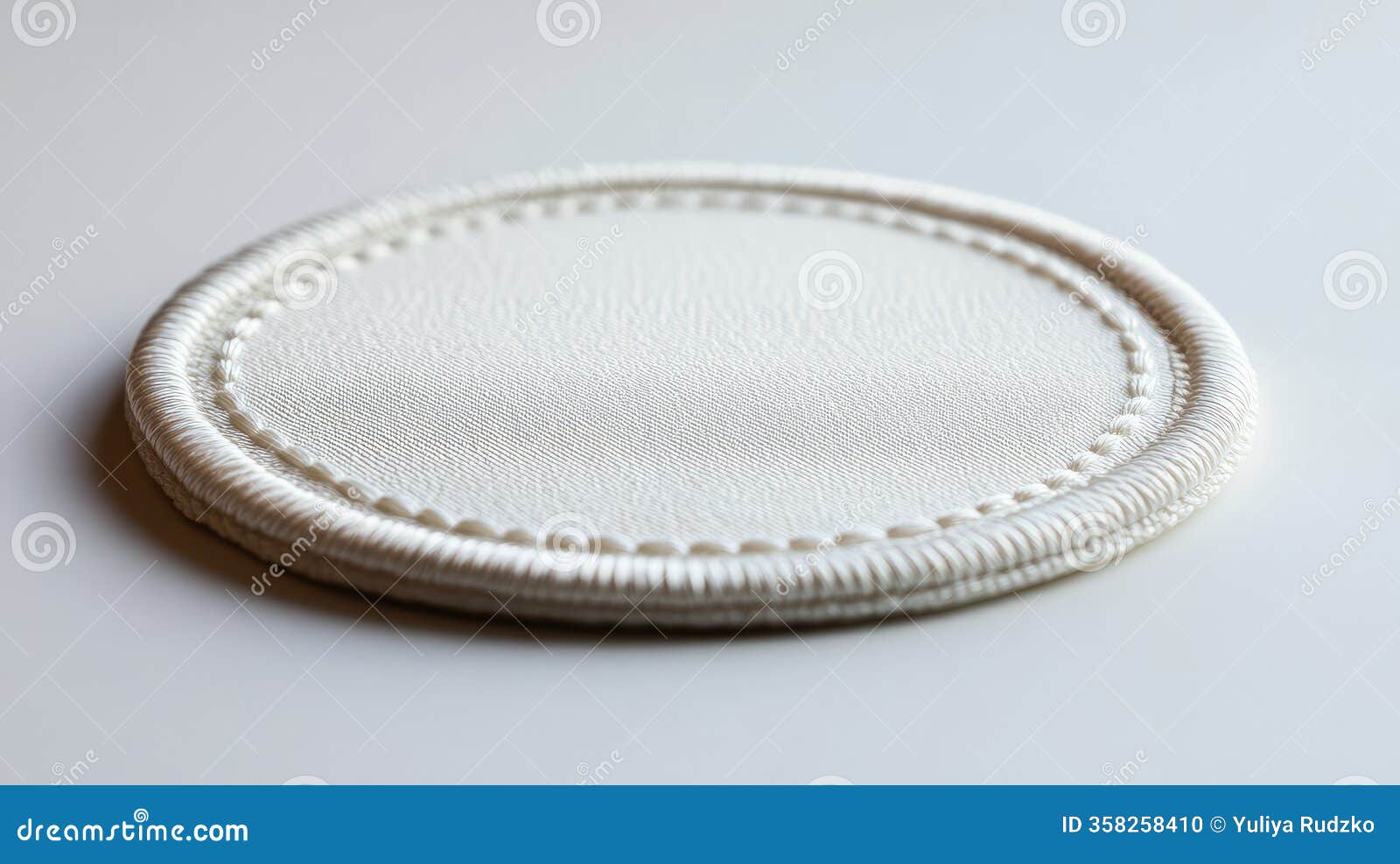High-Resolution Mockup of a Standalone Rounded Embroidered White Patch ...