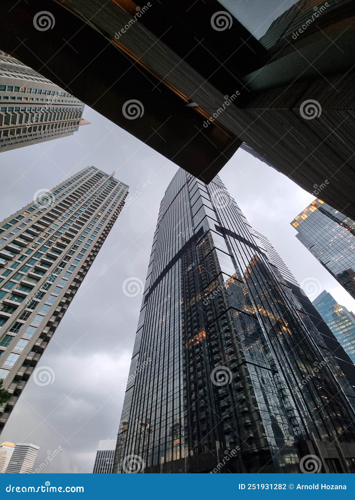 High Rise Building with Cloudy Sky on the Background Stock Photo ...