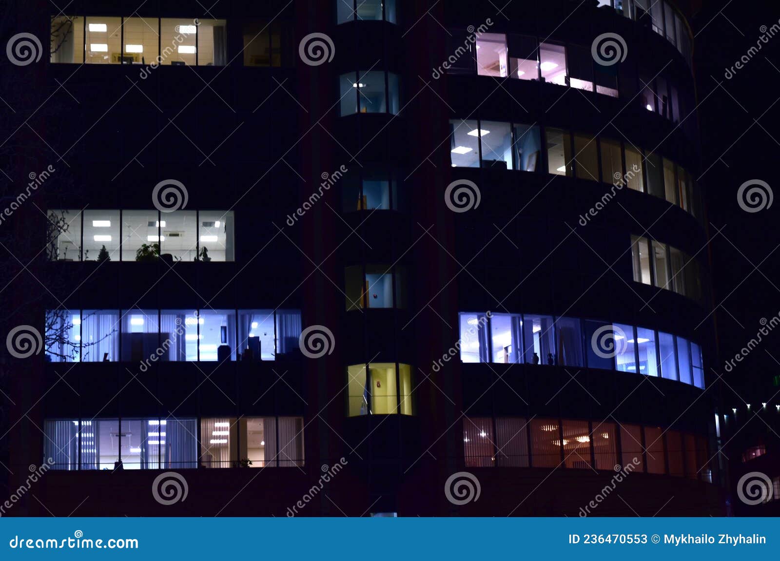 High-rise Building Illuminated by Numerous Windows at Night. Stock ...