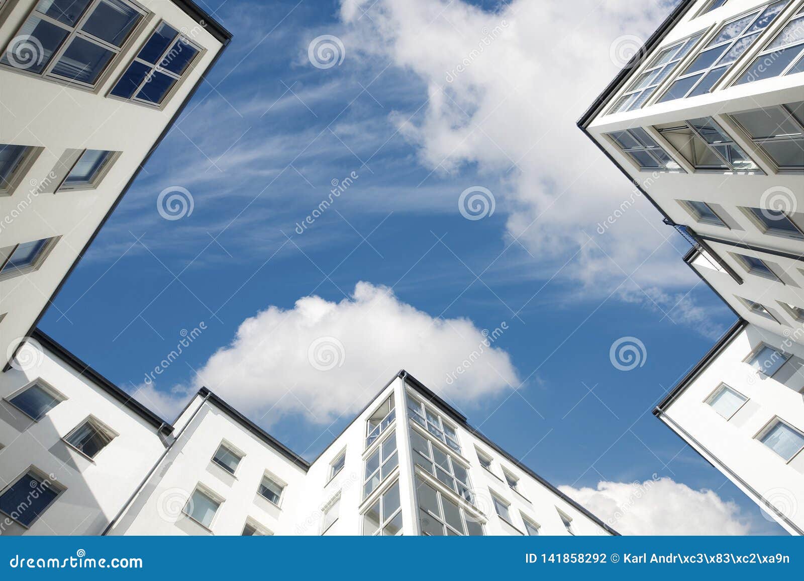 Skyscrapers in Low Perspective with a Blue Sky and Clouds. Stock Photo ...