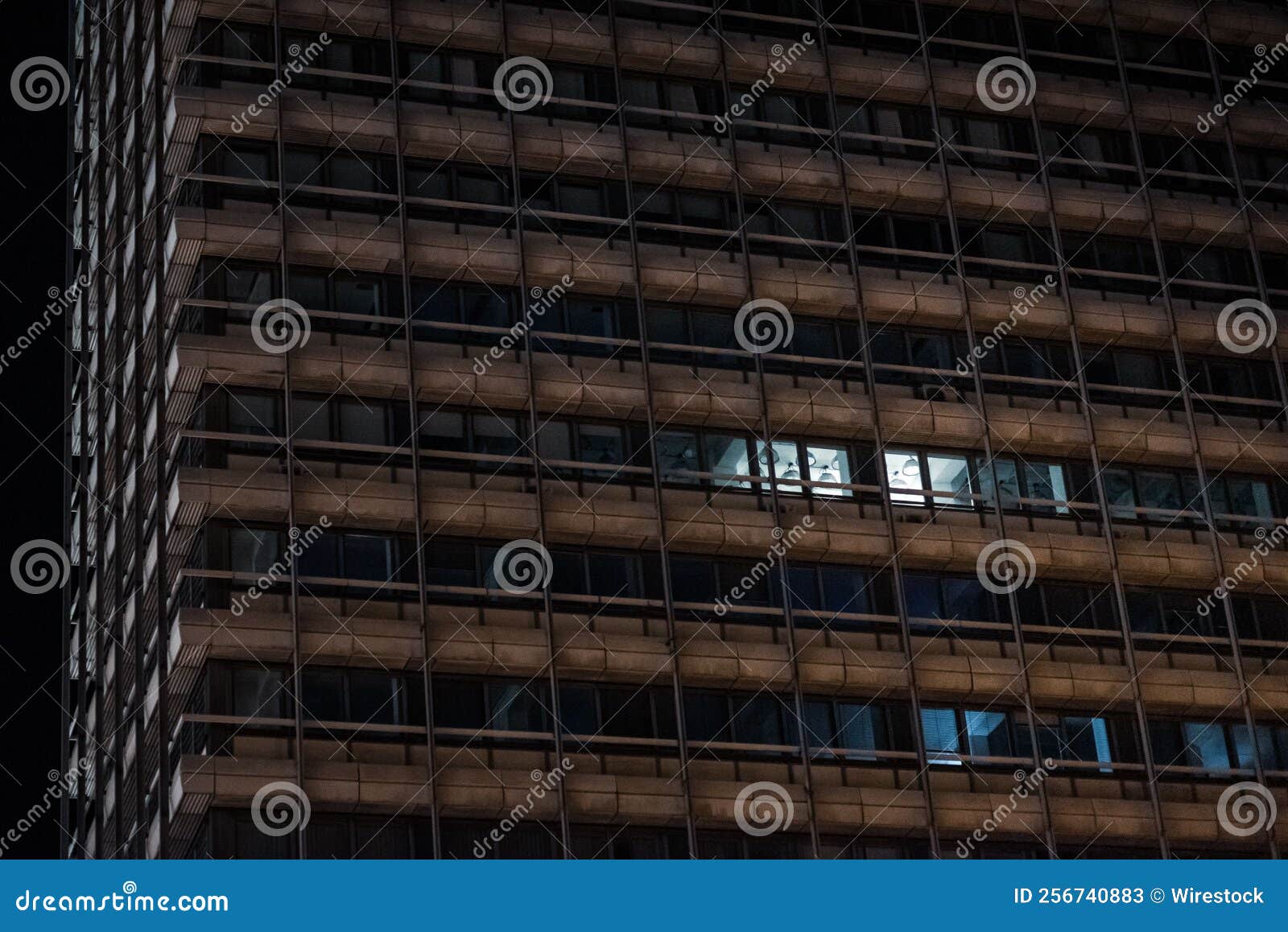 High-rise Building with Some Windows with Burning Light Stock Image ...