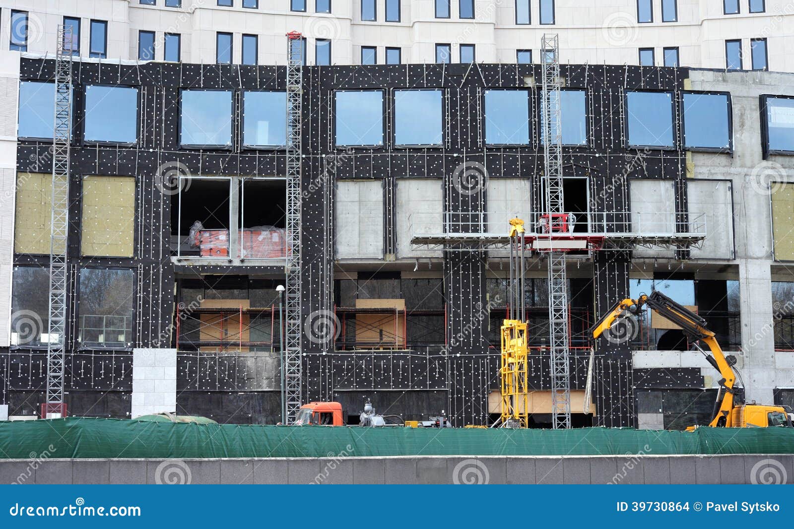 High-rise Building Under Construction with a Waterproofing and Warming ...