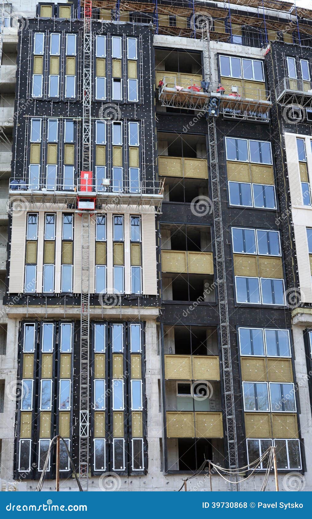 High-rise Building Under Construction with a Waterproofing and Warming ...