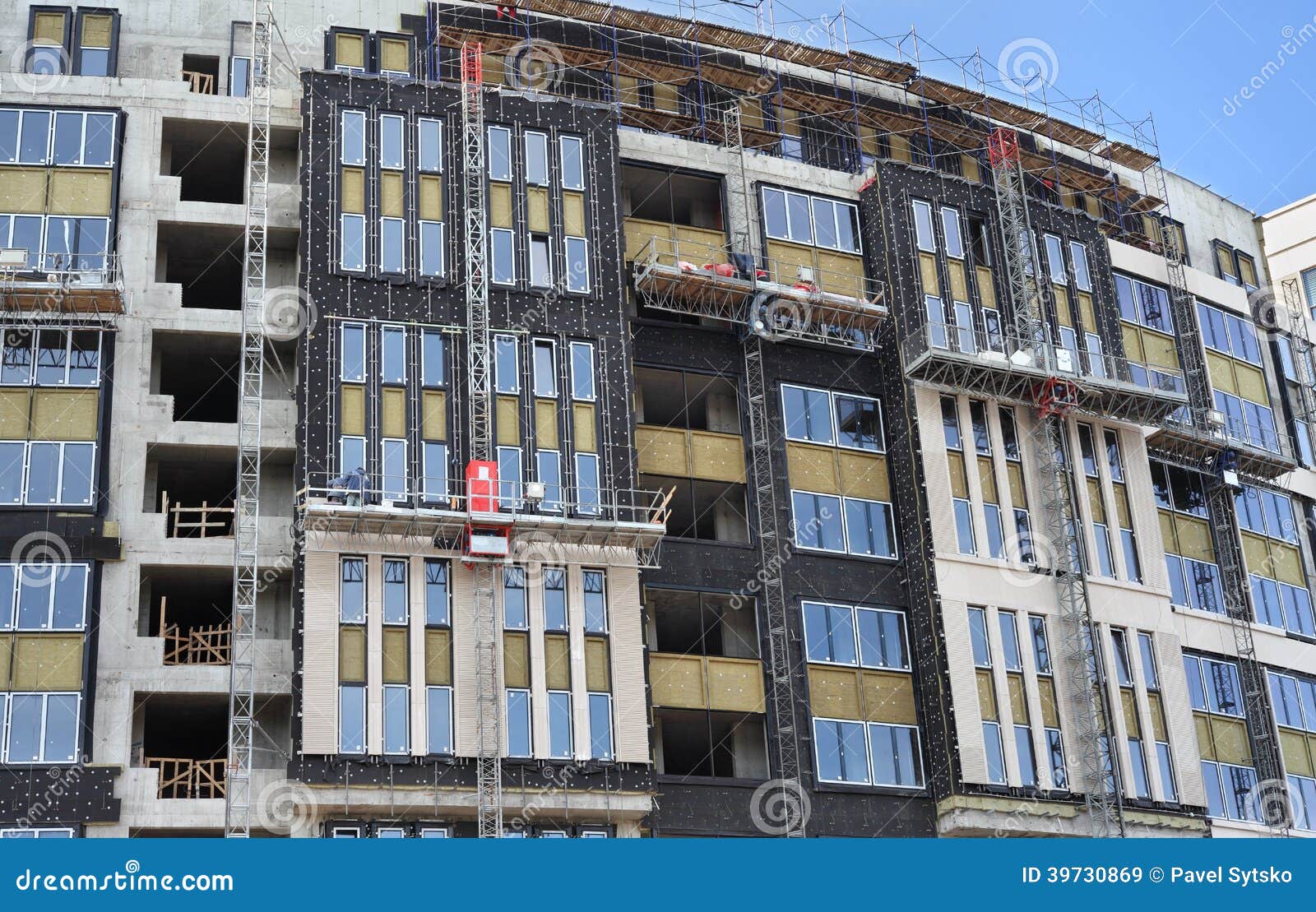 High-rise Building Under Construction with a Waterproofing and Warming ...