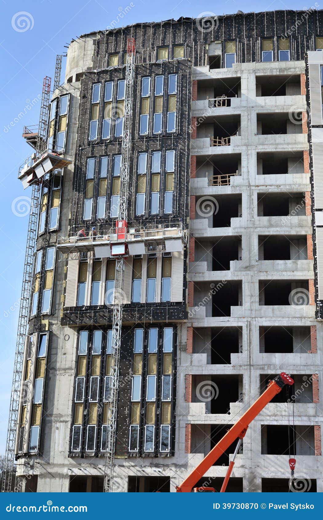 High-rise Building Under Construction with a Waterproofing and Warming ...