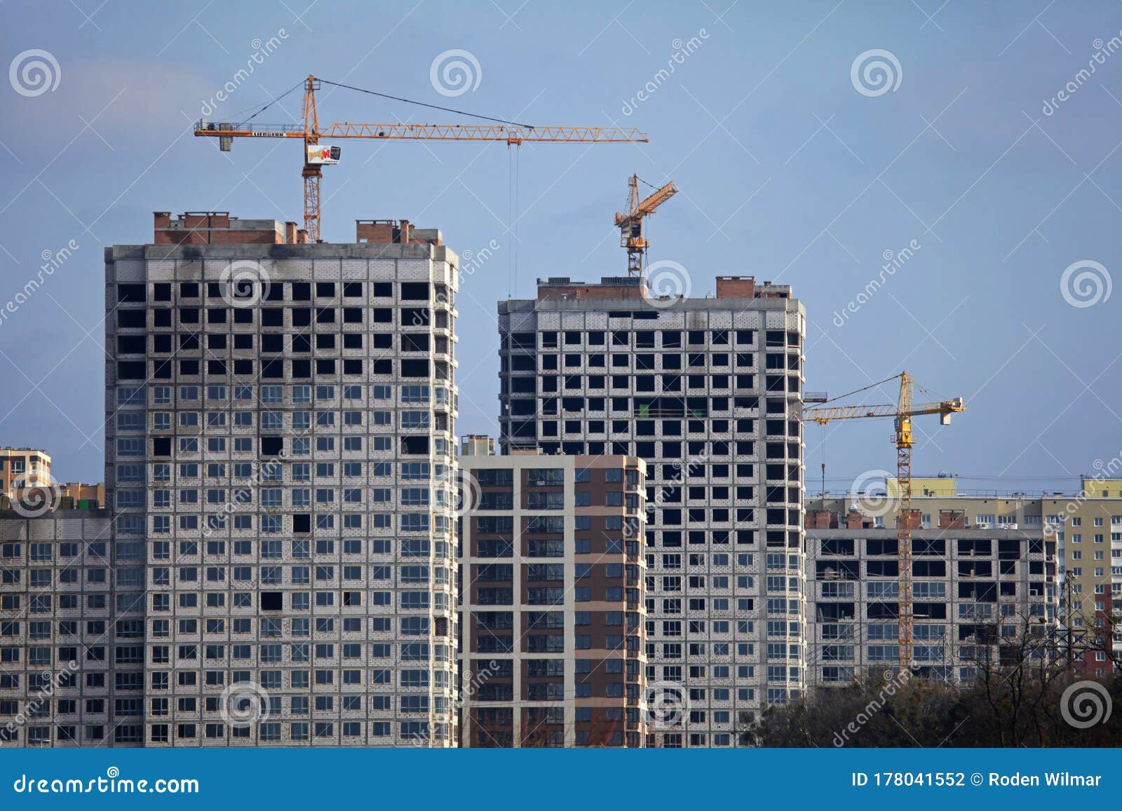 High-rise Construction Cranes and Array of Buildings Under Construction ...