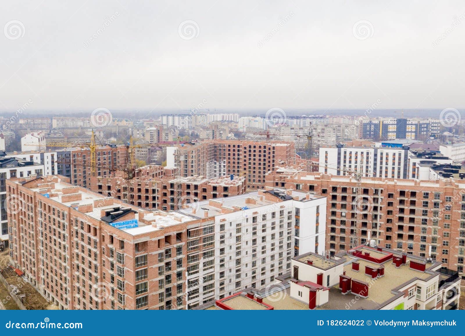 High-rise Multi-storey Buildings Under Construction. Tower Cranes Near ...