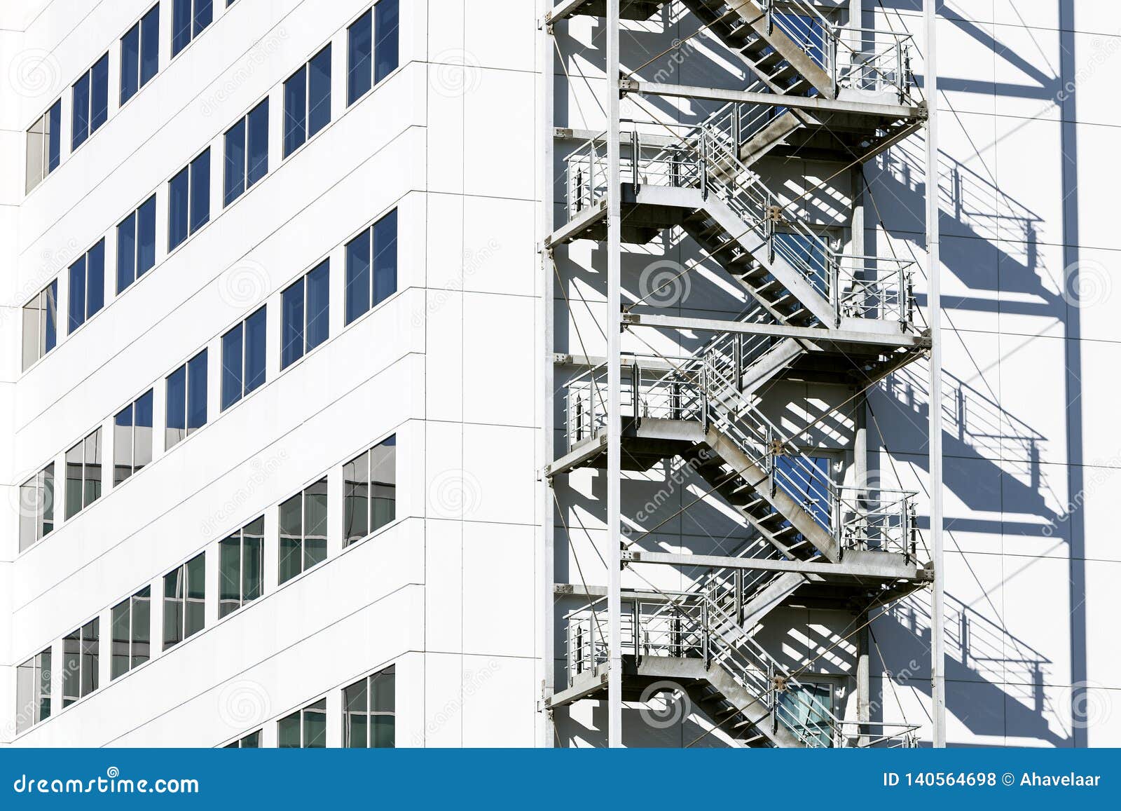 High Rise Office Building with Shadow of Metal Fire Escape Stock Photo ...