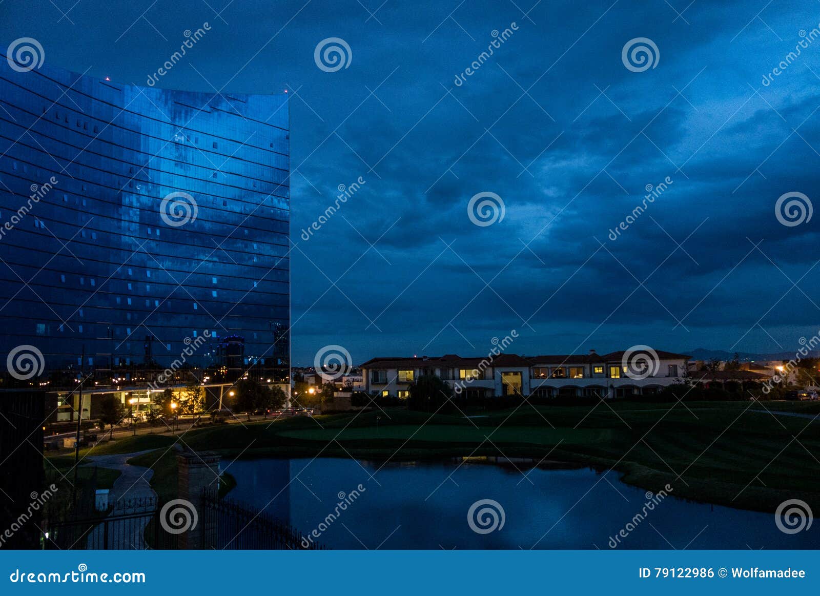 High Rise with Windows Mirroring Sky at Night Stock Photo - Image of ...