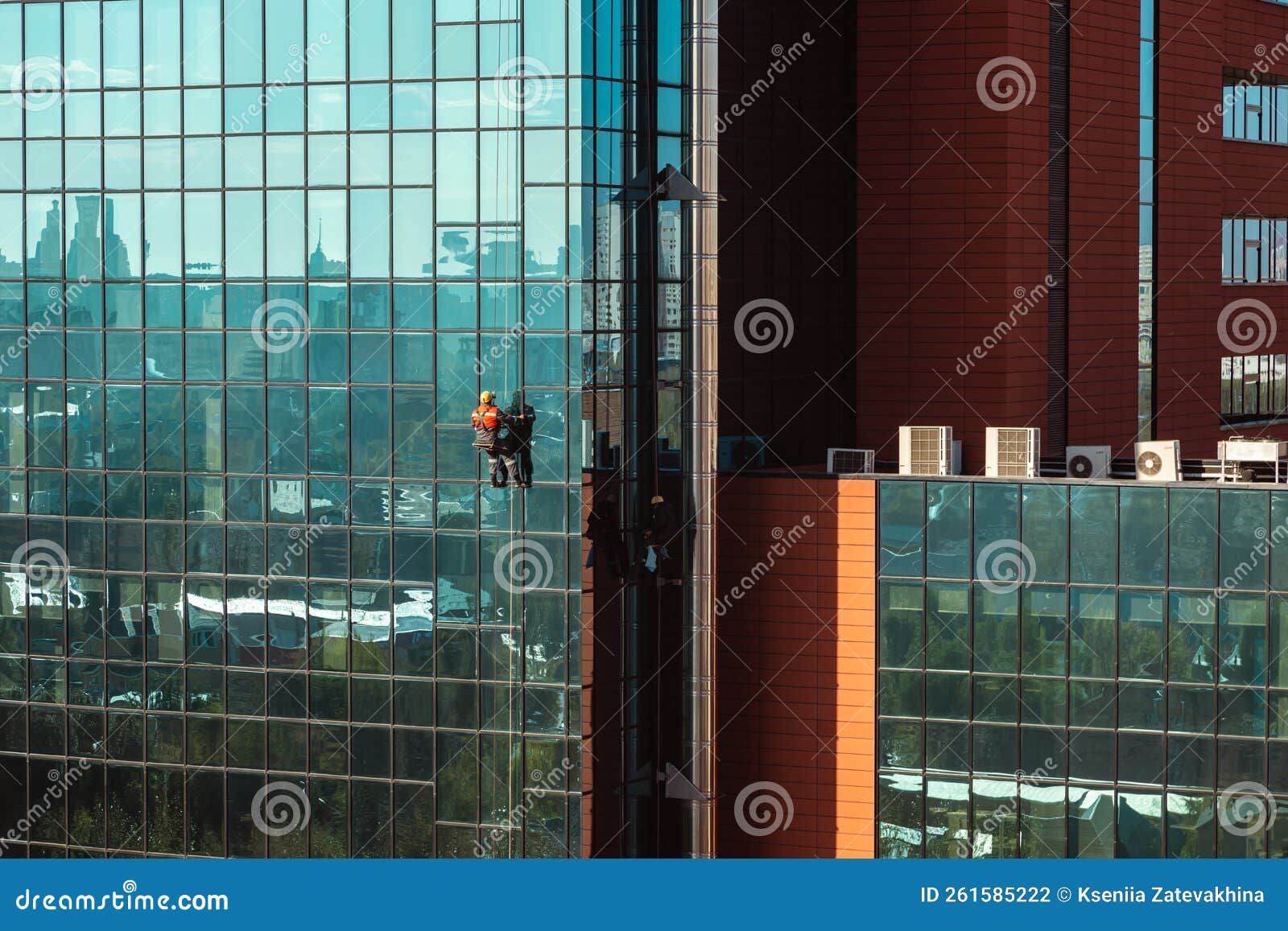High-rise Workers Cleaning the Windows of a Skyscraper Editorial ...