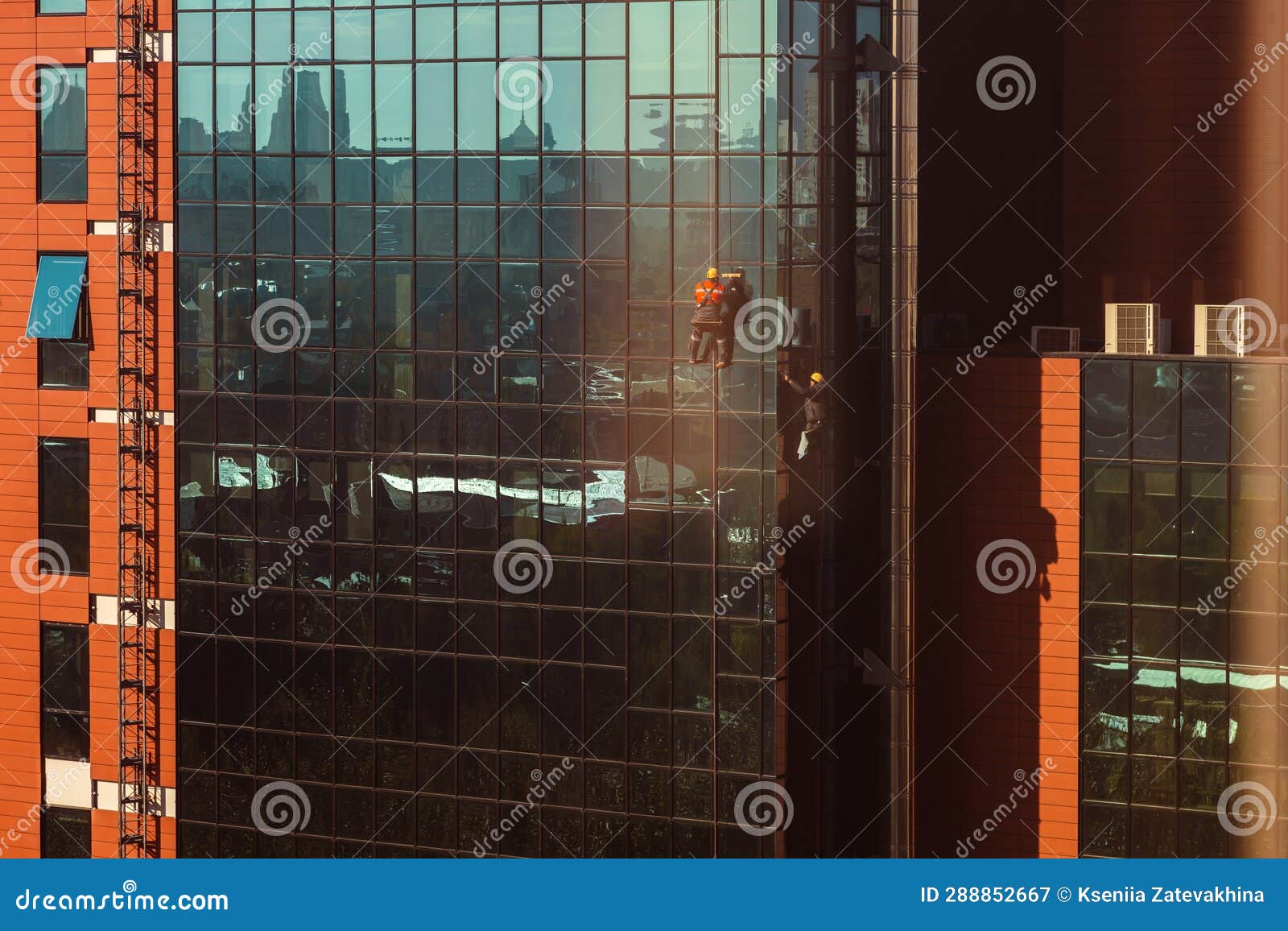 High-rise Workers Cleaning the Windows of a Skyscraper Stock Image ...