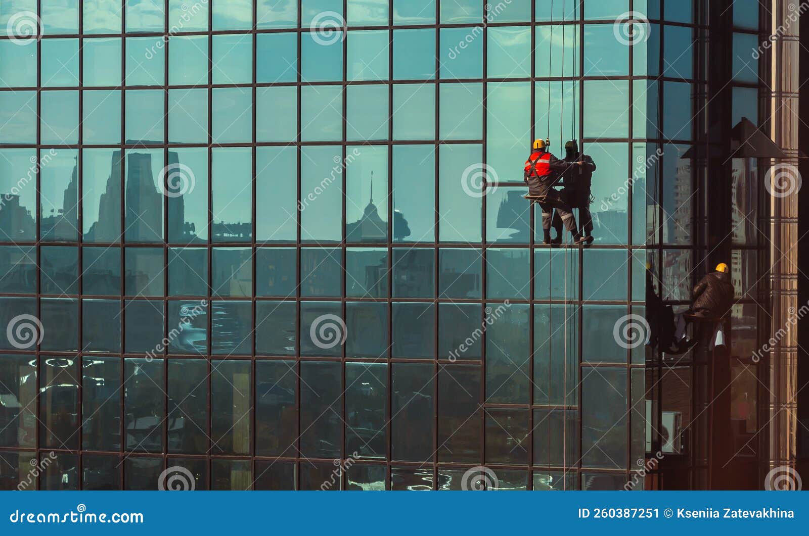 High-rise Workers Wash the Facade and Glass of a Skyscraper Stock Image ...