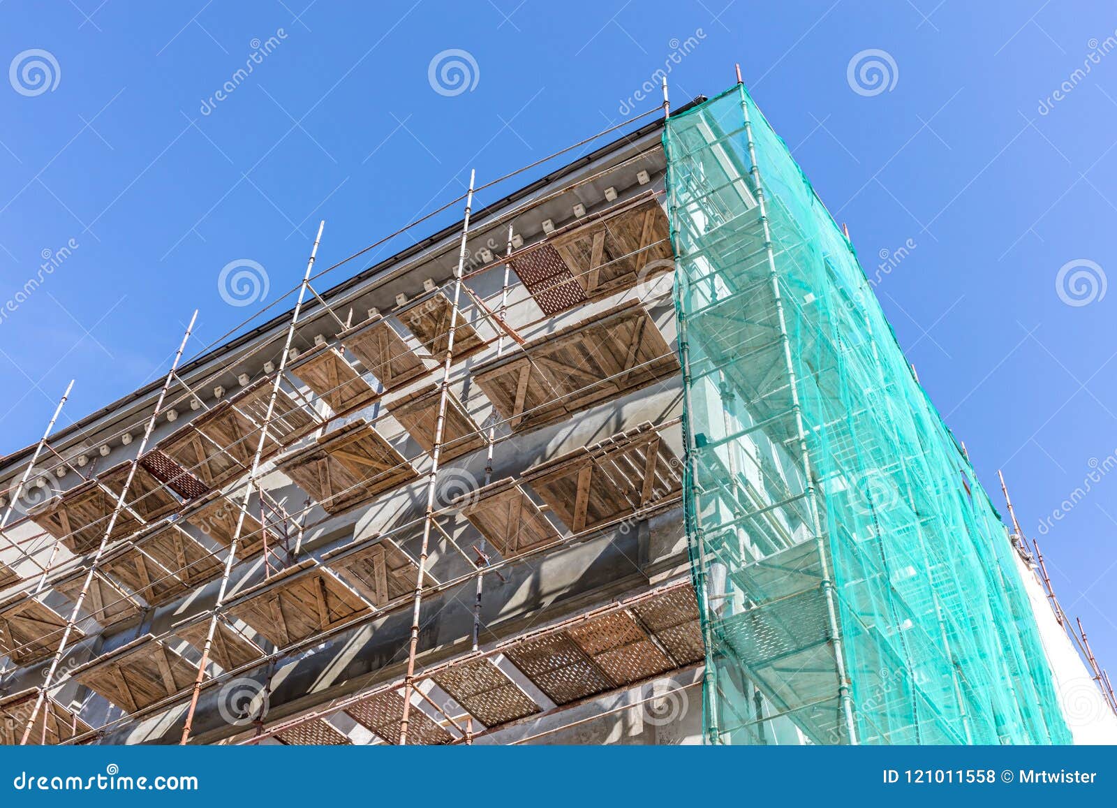 Scaffolding for Building Facade Renovation Against Blue Sky Stock Photo ...