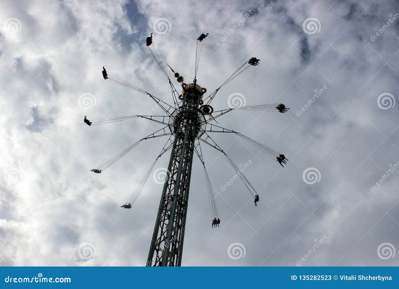 High Scary Carousel Attraction with People Silhouette Stock Image ...
