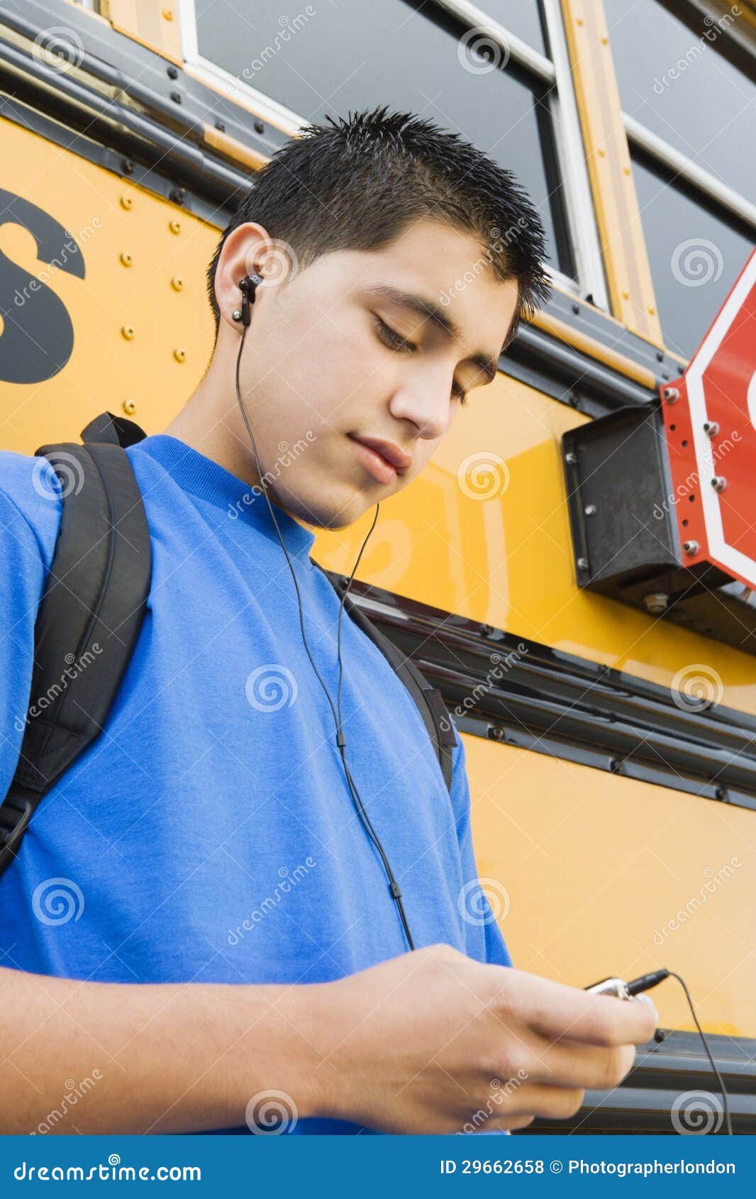 High School Boy Listening To MP3 Player Stock Photo - Image of holding ...