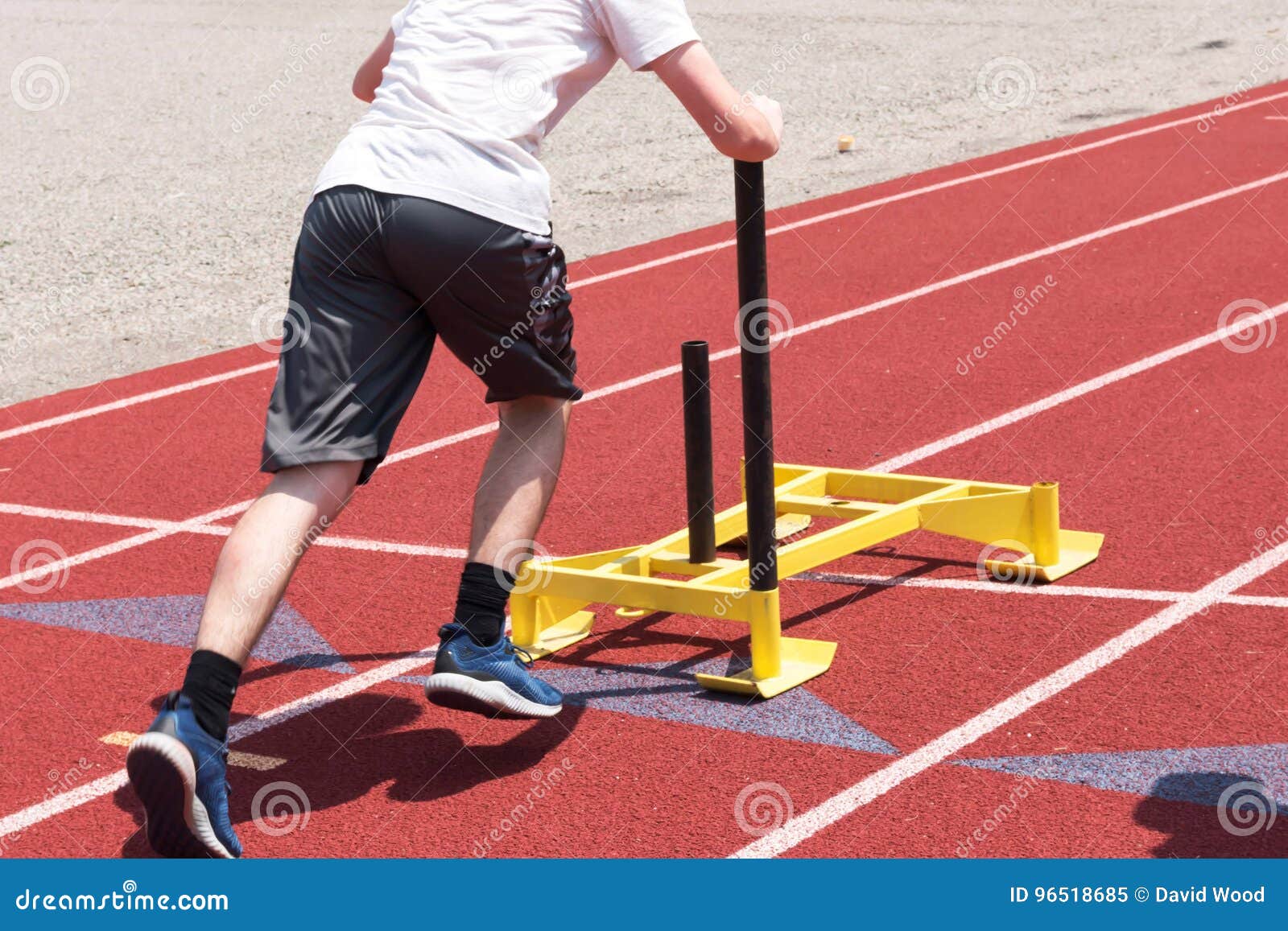 High School Boy Pushing a Sled on a Track Stock Image - Image of people ...