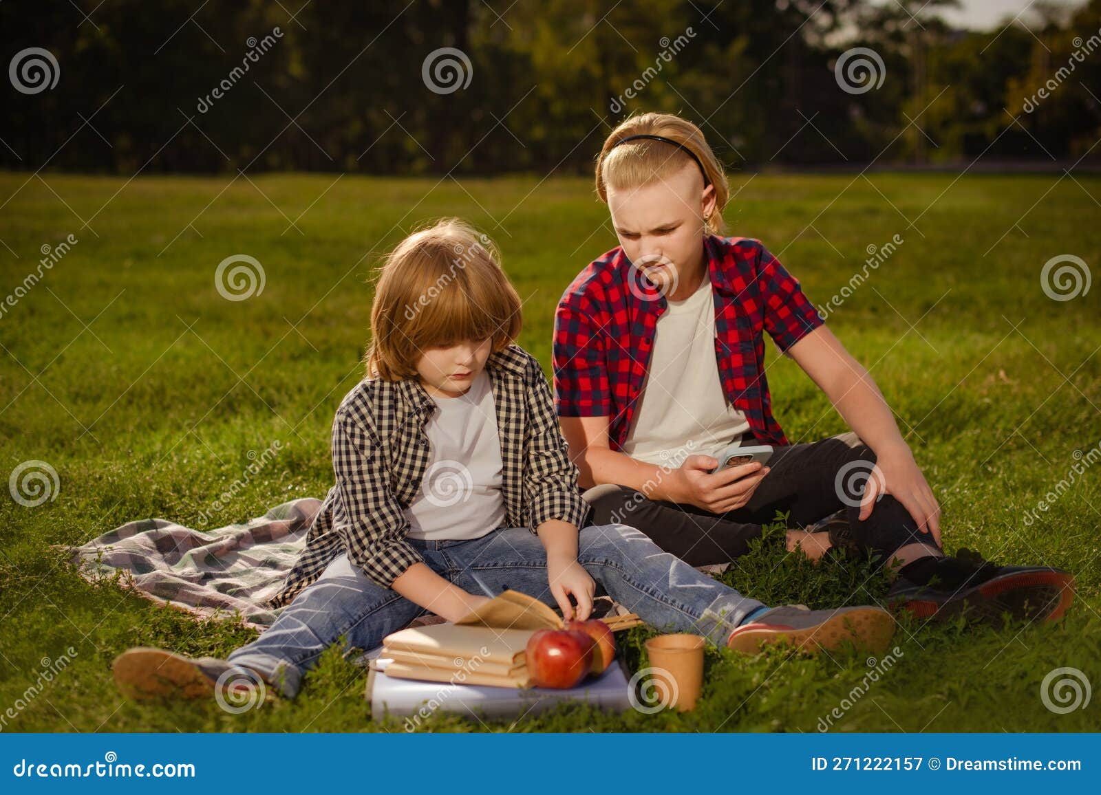 High School Boy Student Checking Junior School Student S Homework on ...