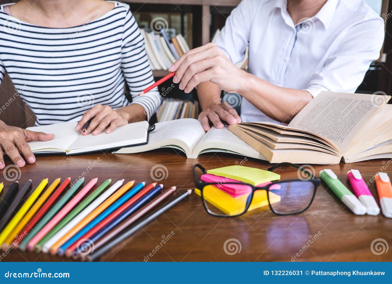 High School or College Student Group Sitting at Desk in Library Stock ...