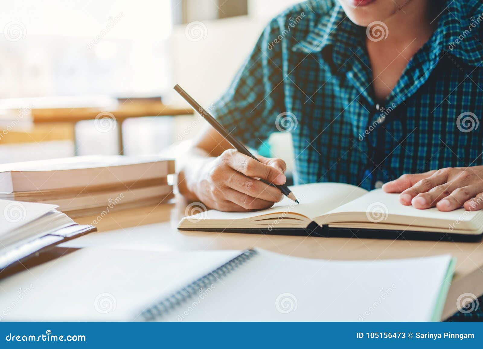 High School or College Student Studying and Reading Together in Stock ...