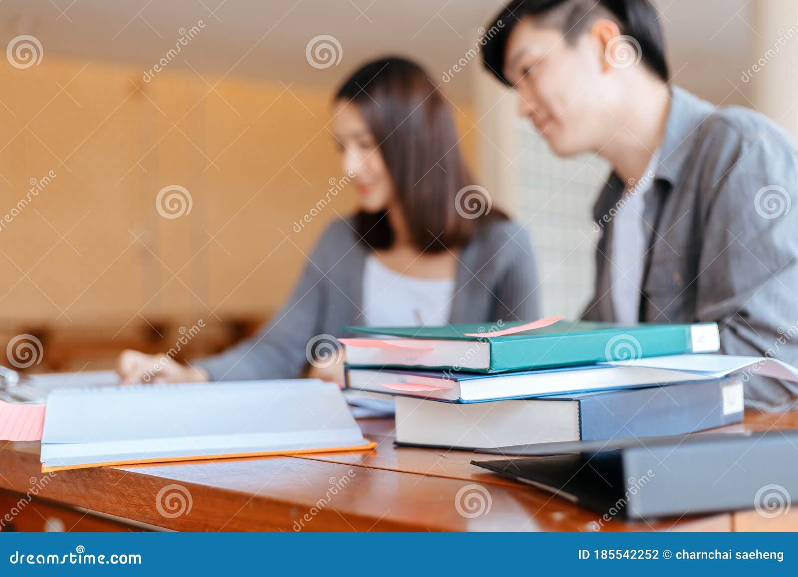 High School or College Students Group Catching Up Workbook and Learning ...