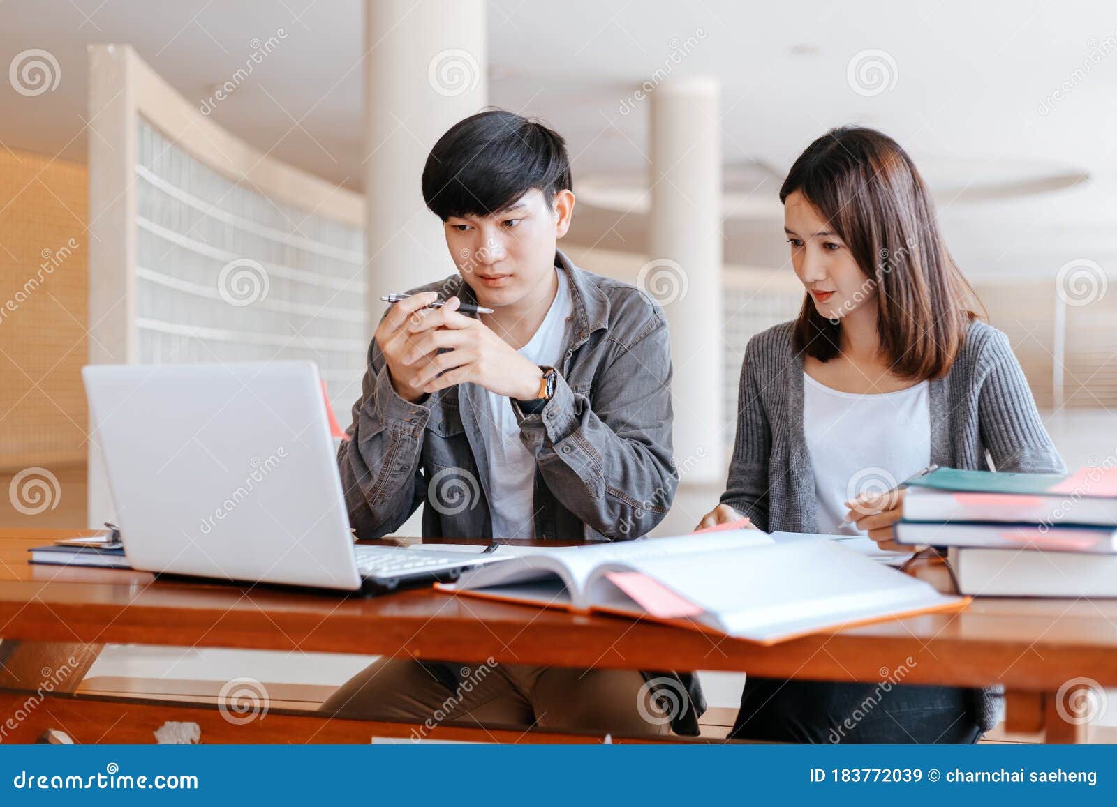 High School or College Students Group Catching Up Workbook and Learning ...