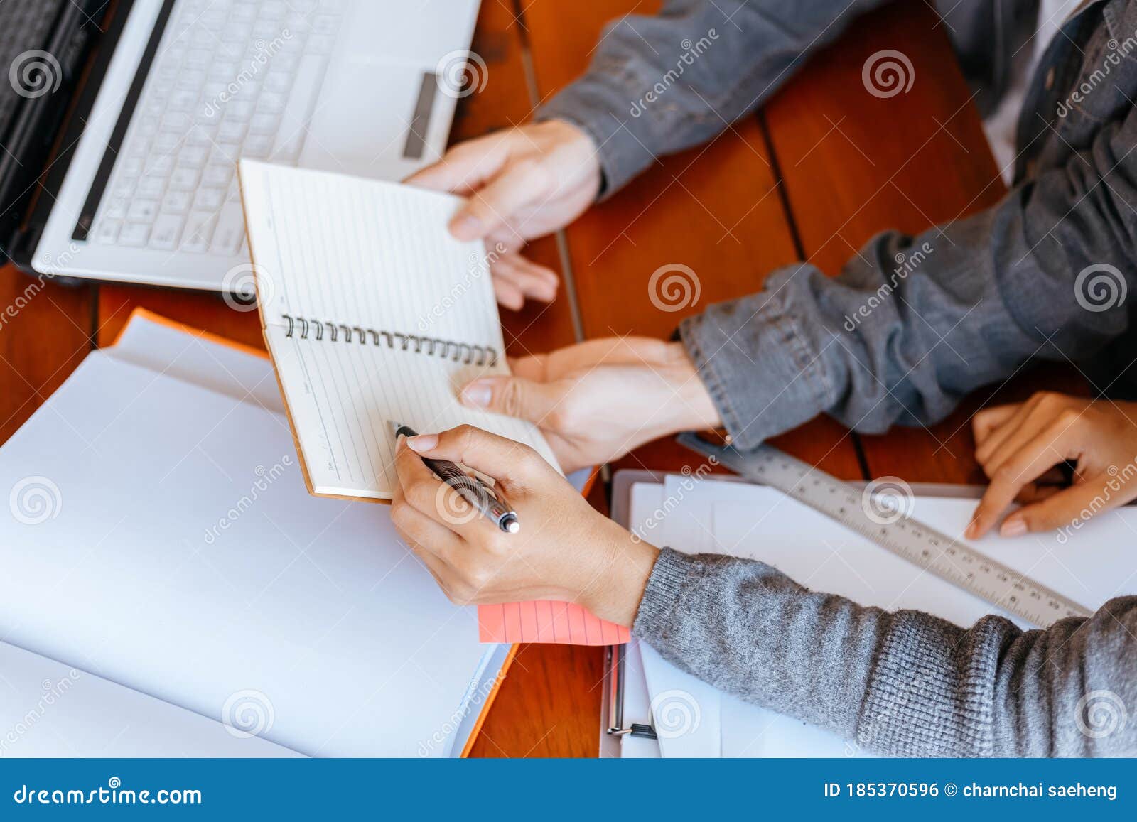 High School or College Students Group Catching Up Workbook and Learning ...