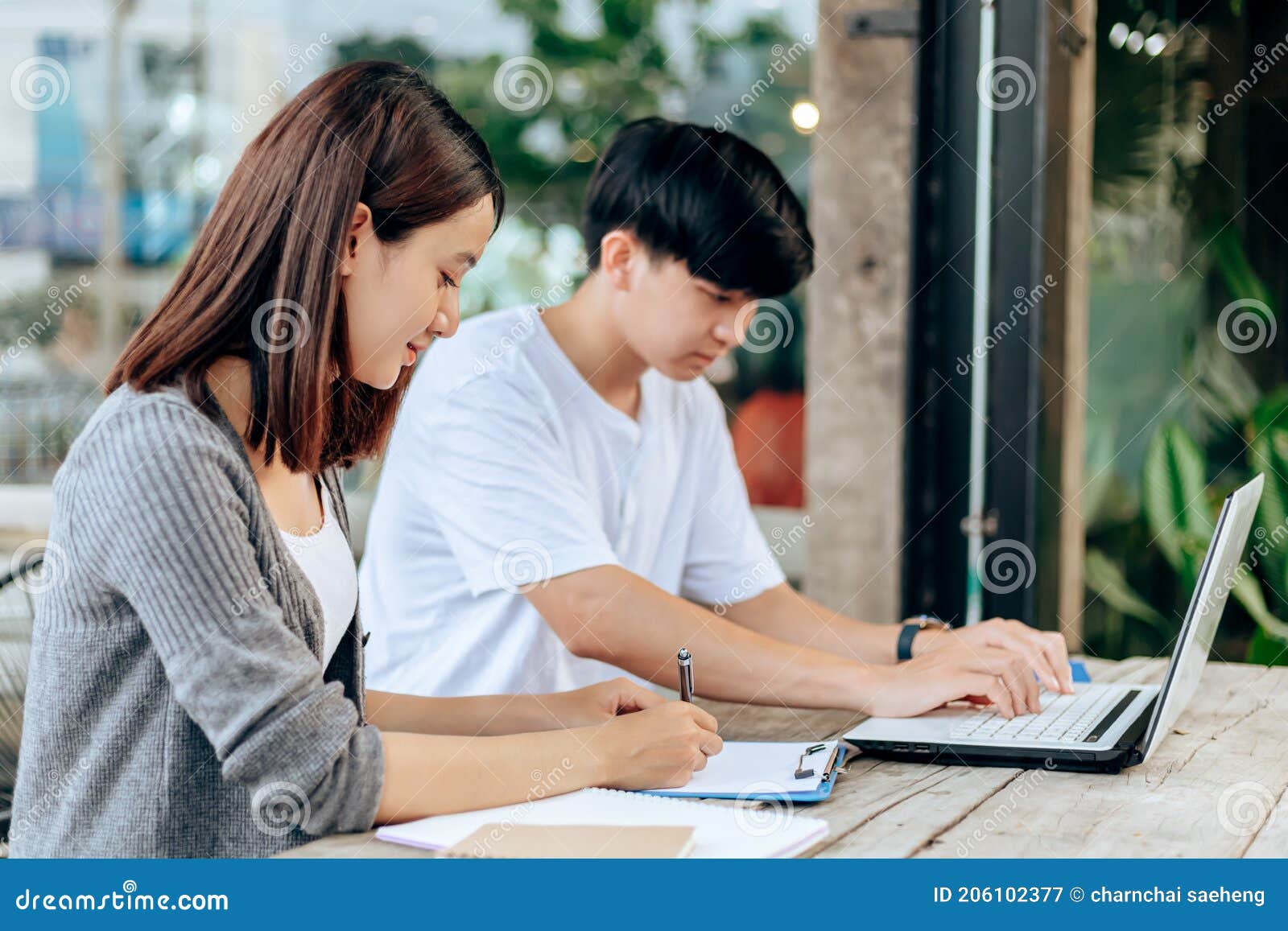 High School or College Students Group Catching Up Workbook and Learning ...