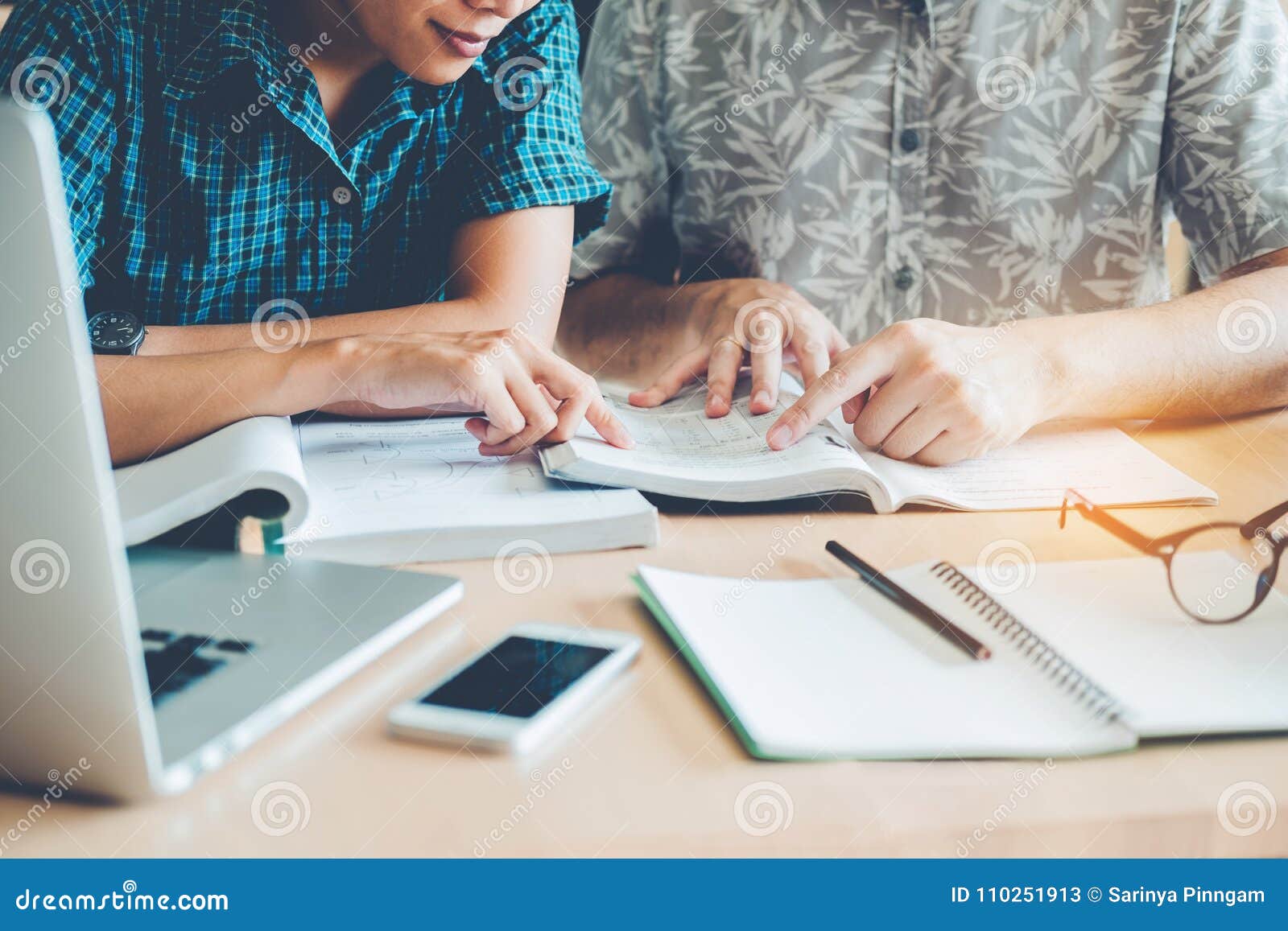 High School or College Students Studying and Reading Together in Stock ...
