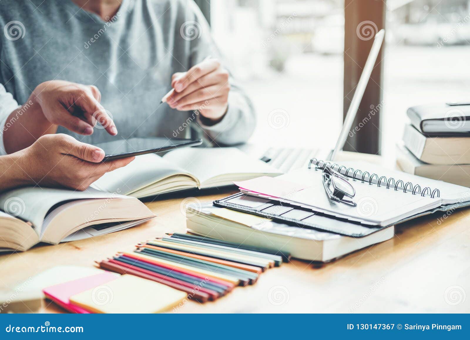 High School or College Students Studying and Reading Together in Stock ...