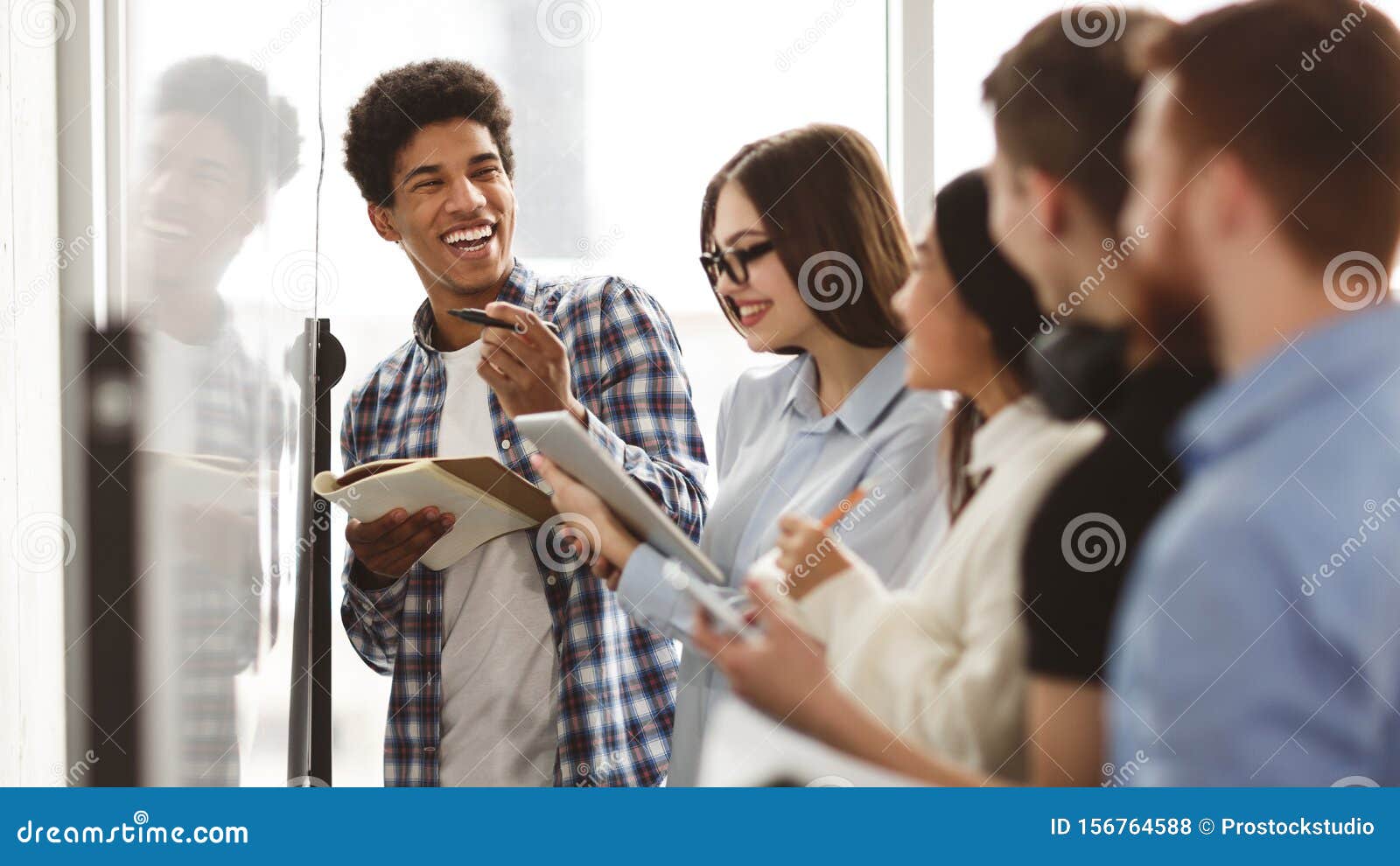 High School Friends Laughing, Solving Problems on Whiteboard Stock ...