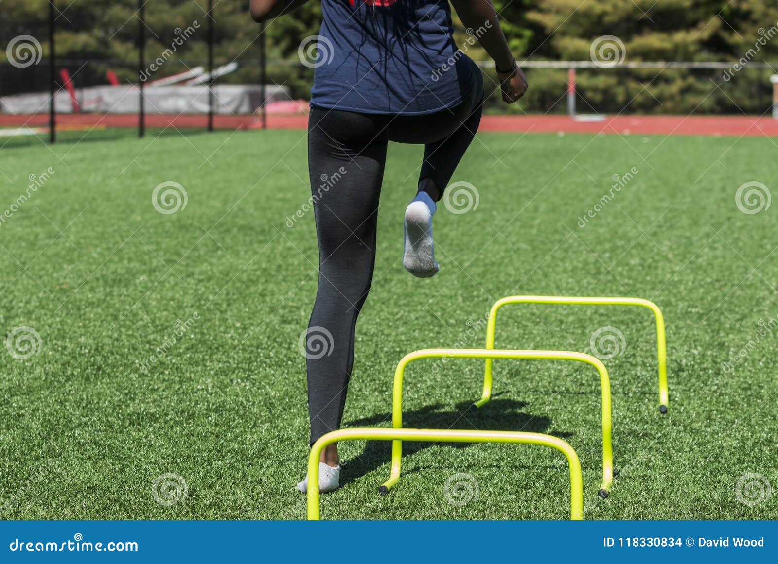 Athlete with No Shoes on Stepping Over Hurdles on Turf Stock Photo ... Athlete with No Shoes on Stepping Over Hurdles on Turf Stock Photo ...