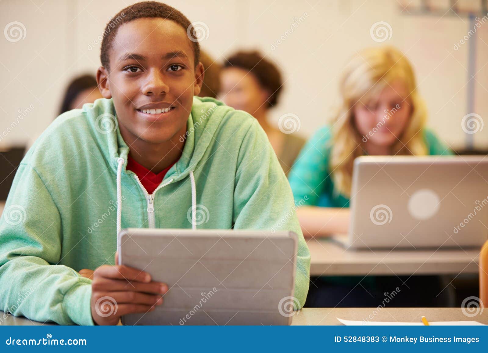 High School Student at Desk in Class Using Digital Tablet Stock Image ...